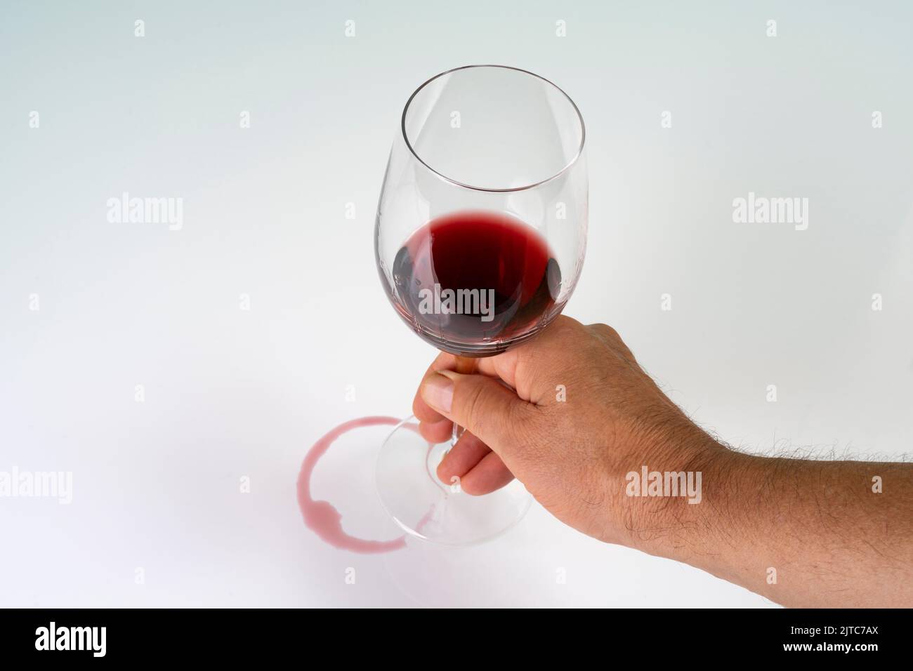 the imprint of red wine left by a glass on a white surface Stock Photo ...