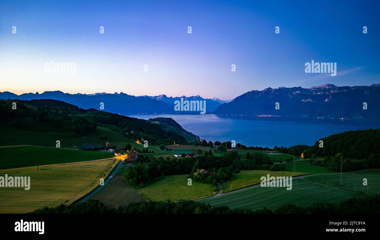 An aerial shot of the Lausanne landscape next to Lake Geneva in ...