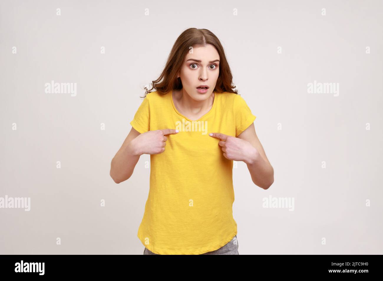 This is me. Amazed attractive teenager girl with brown hair pointing to ...