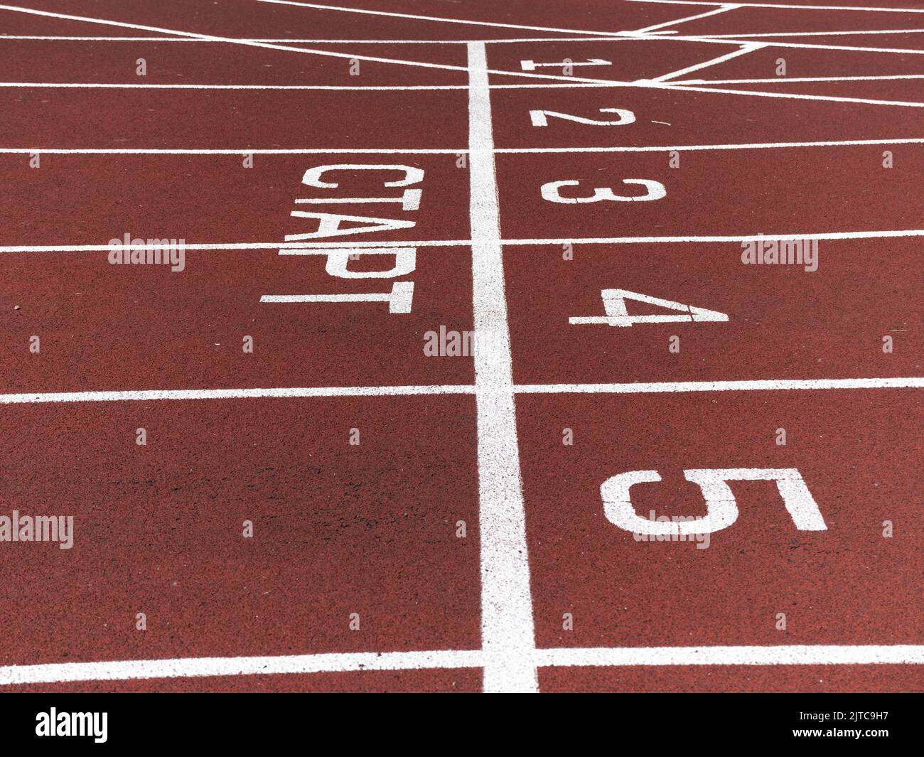 Red treadmill at the stadium with white lines Stock Photo - Alamy