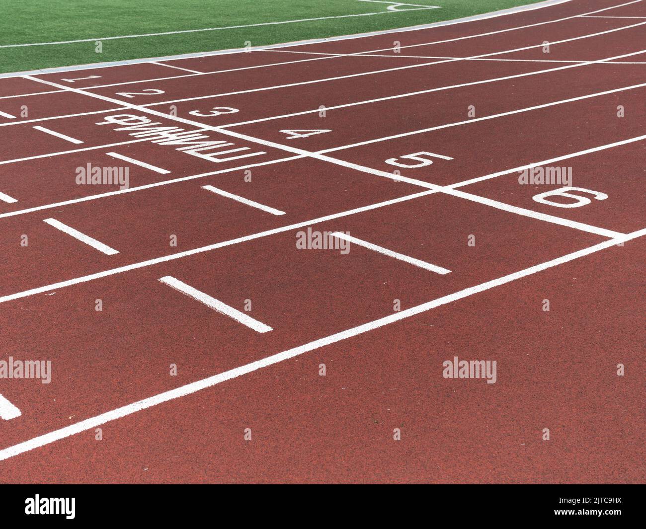 Red treadmill at the stadium with white lines Stock Photo - Alamy