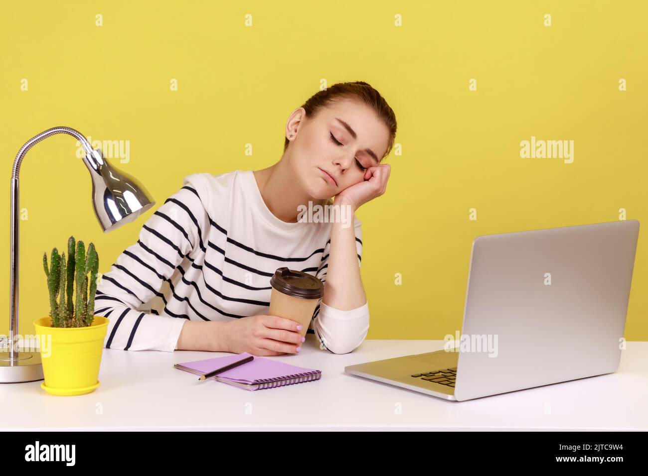 Sleepy woman office worker napping sitting at workplace with laptop on ...