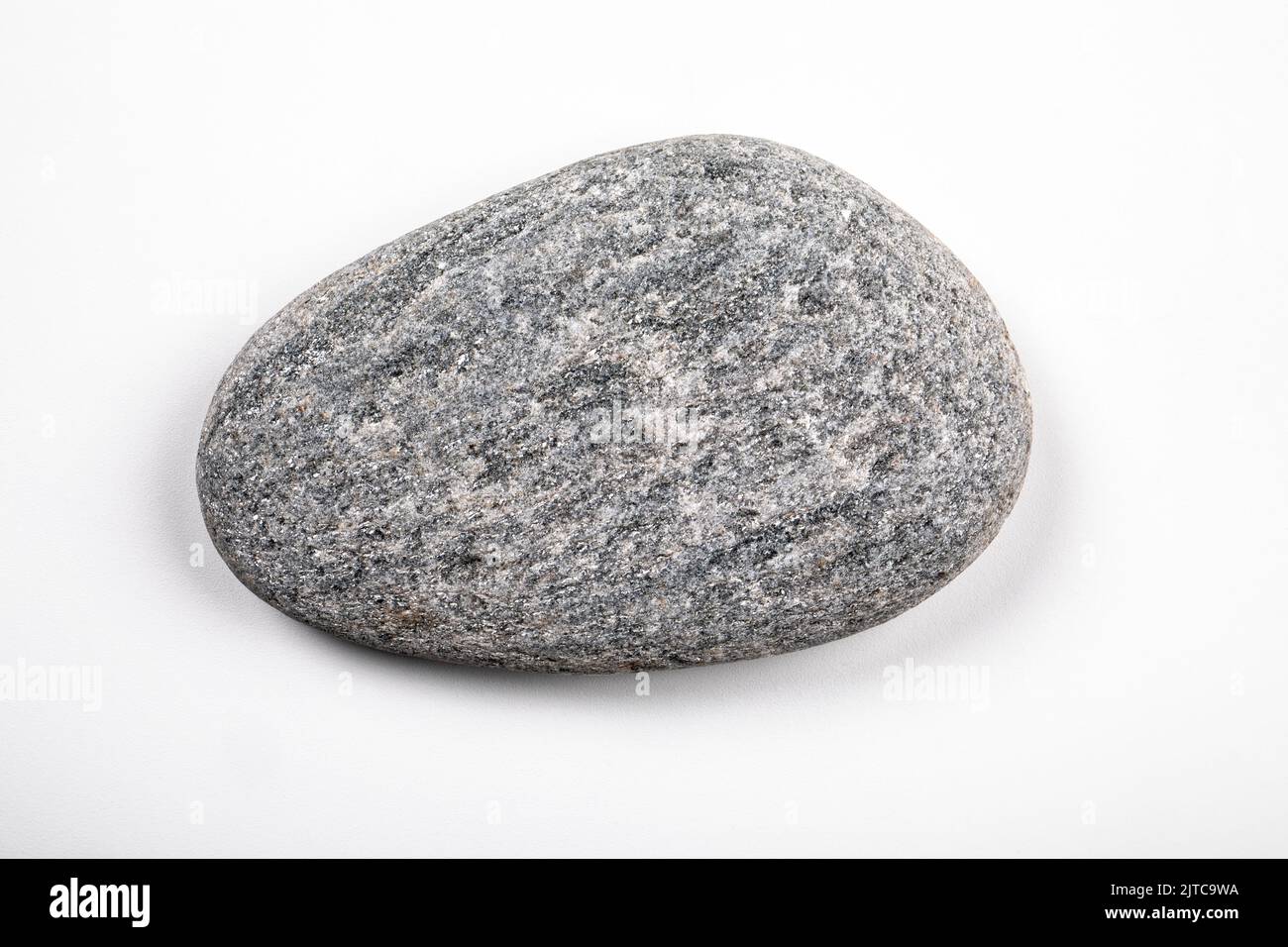 Gray, oval stone on a white background Stock Photo - Alamy