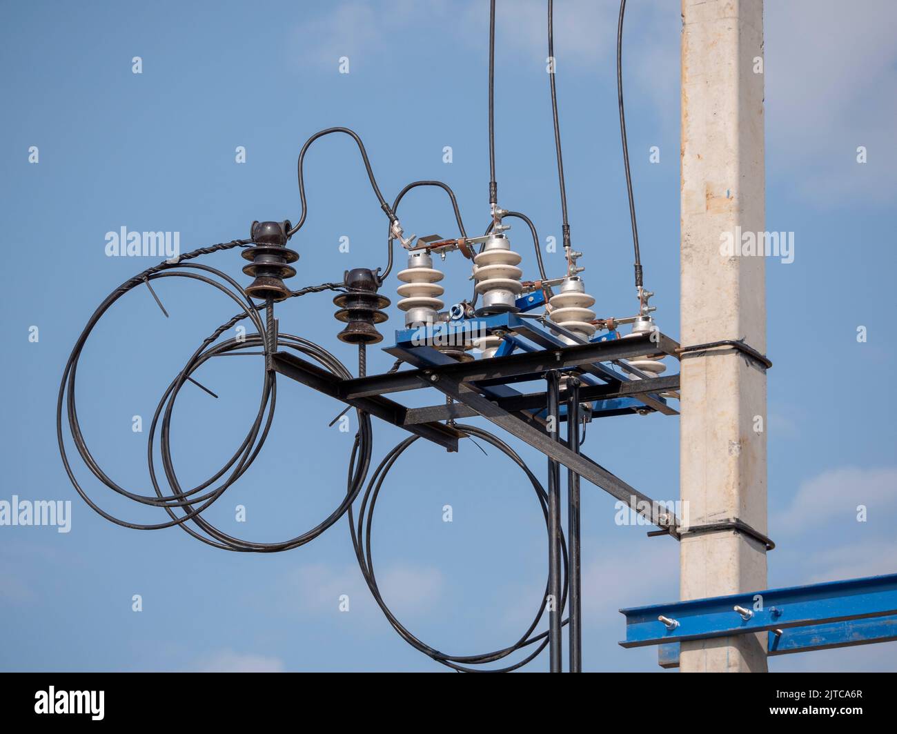 Electric transformer with wires and an insulator against the sky Stock ...