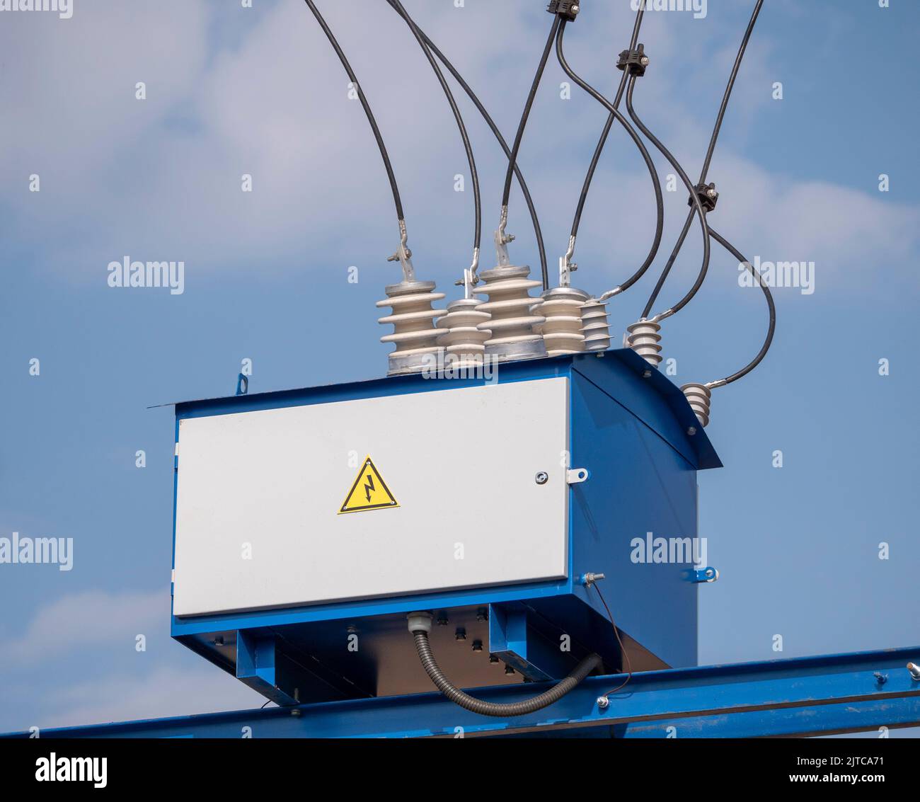Electric transformer with wires and an insulator against the sky Stock ...