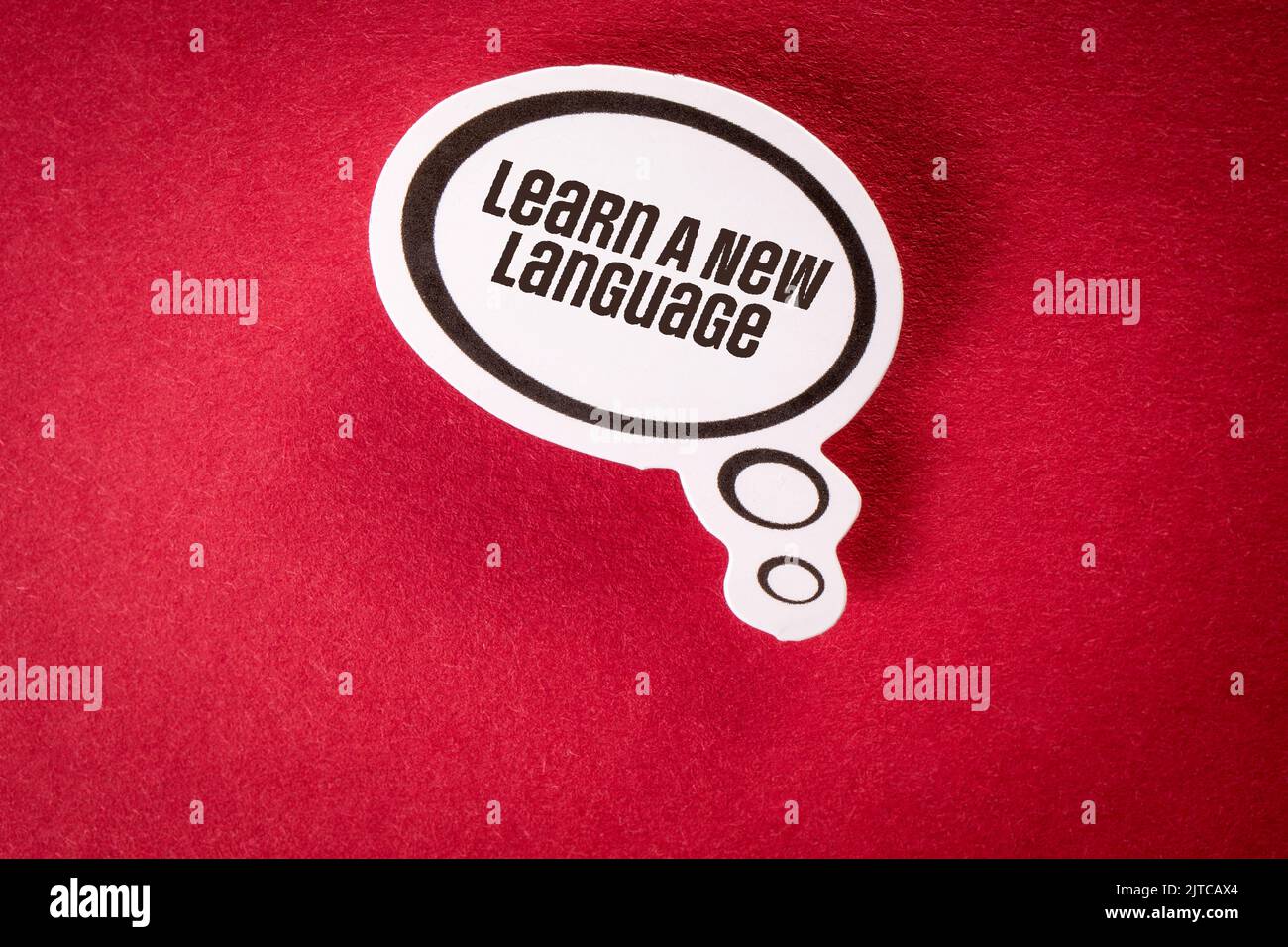 Learn A New Language. Speech bubble with text on red background Stock ...