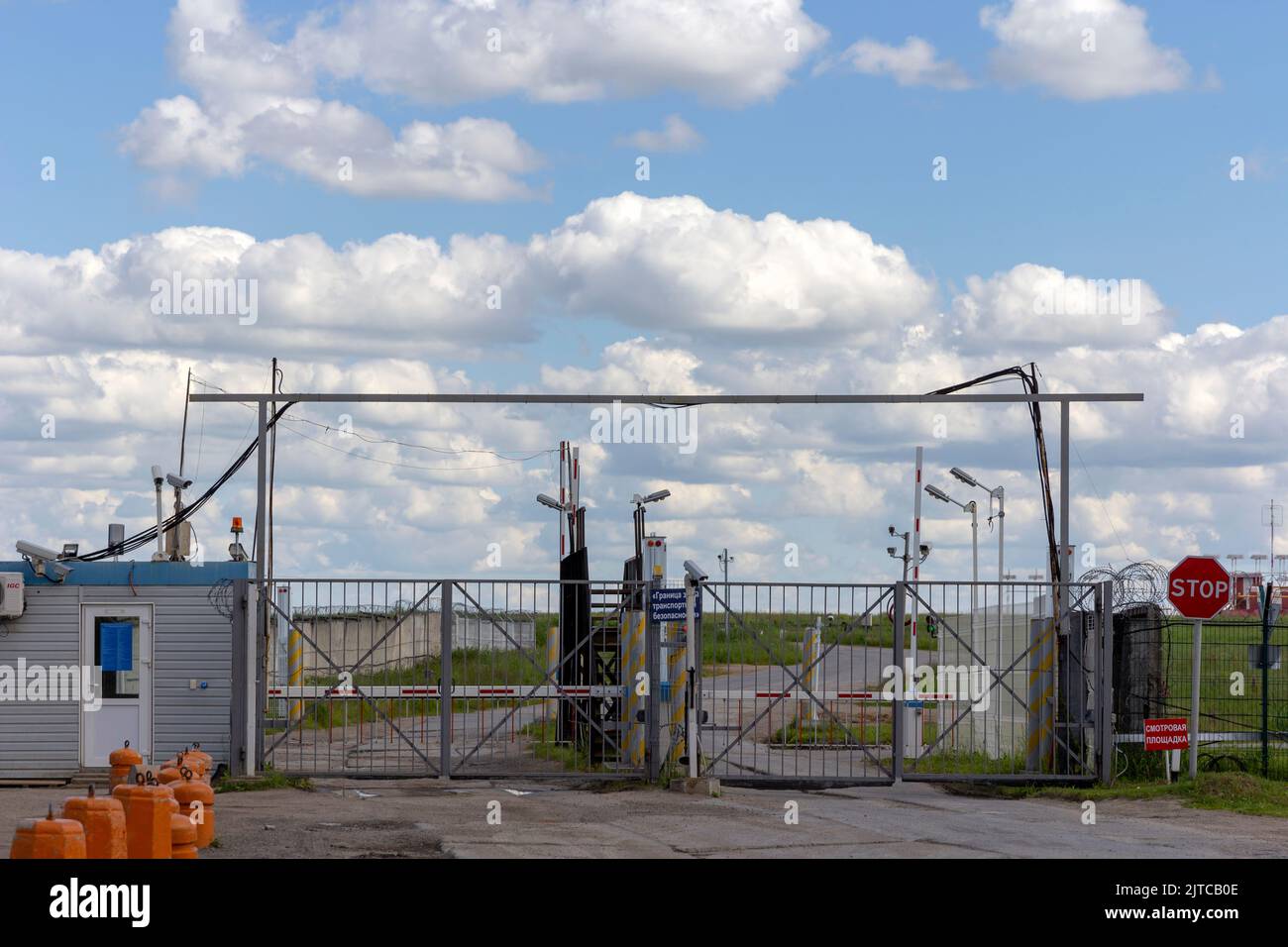 Gate and barrier of the checkpoint with a stop sign Stock Photo - Alamy