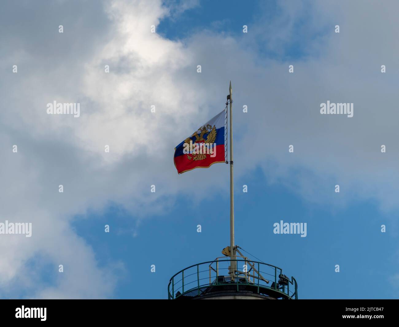 Russian flag fluttering in the wind on a flagpole Stock Photo - Alamy