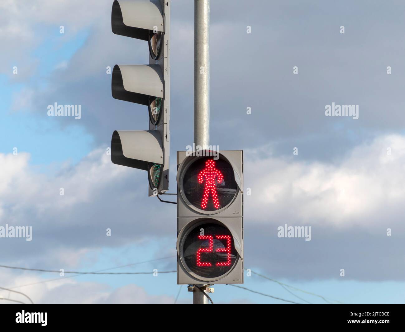 Traffic light for pedestrians with a prohibitory red color and a figure ...