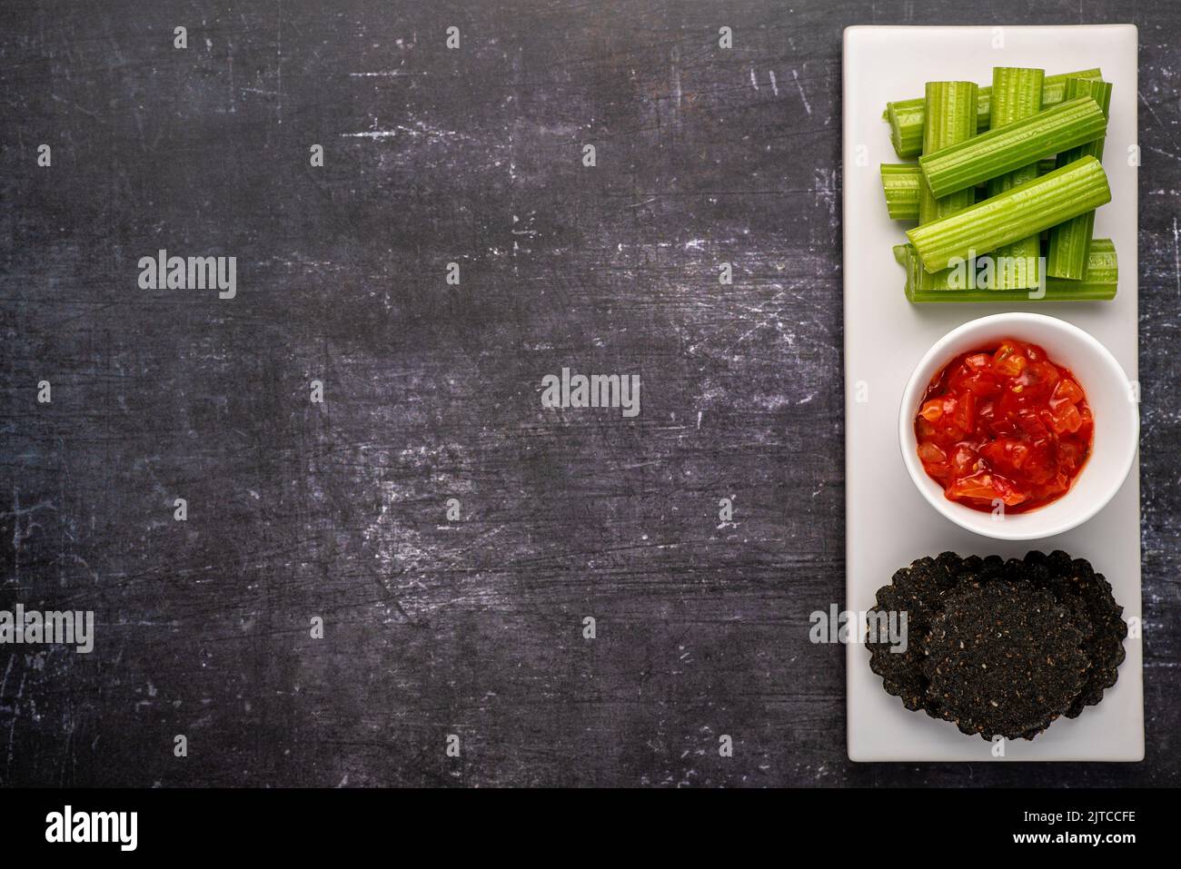 Food photography of appetizer, celery, cracker, salsa Stock Photo - Alamy