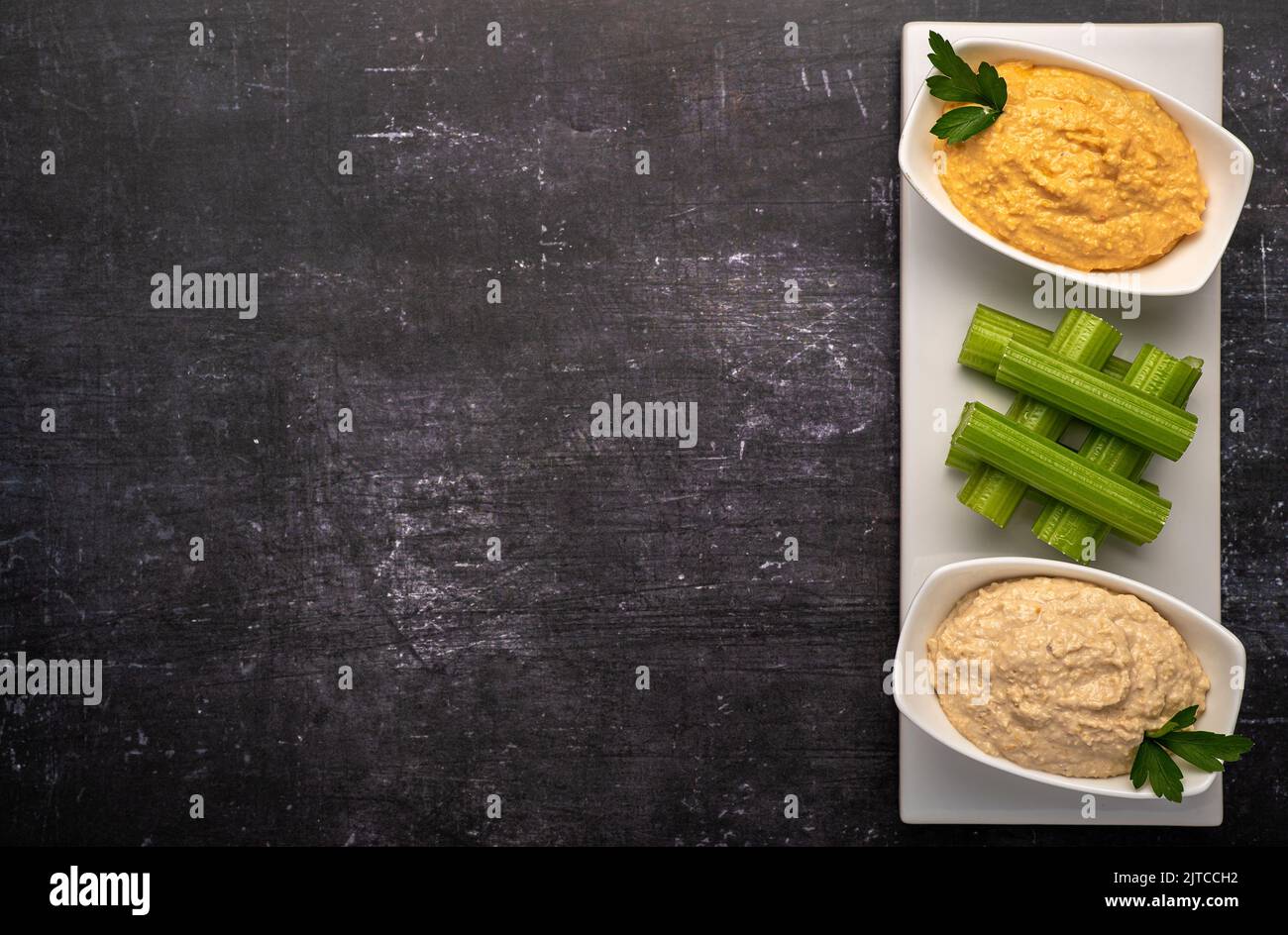 Food photography of appetizer, hummus, celery Stock Photo - Alamy