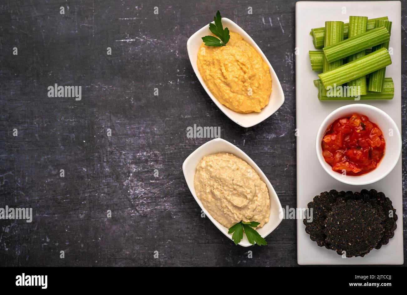 Food photography of appetizer, hummus, celery, cracker, salsa Stock ...