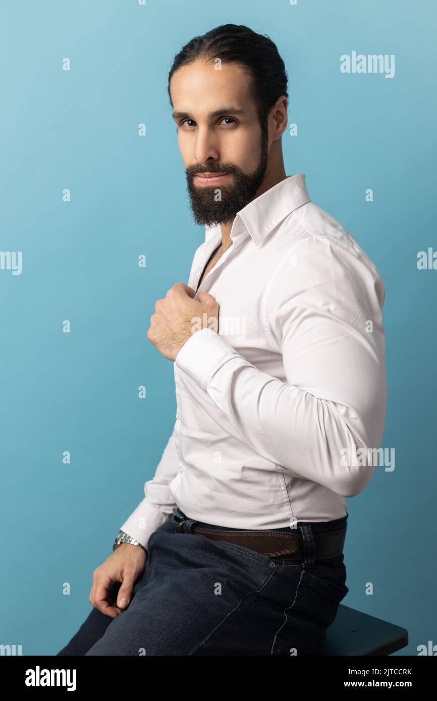 Side view portrait of strong confident man with beard wearing white ...