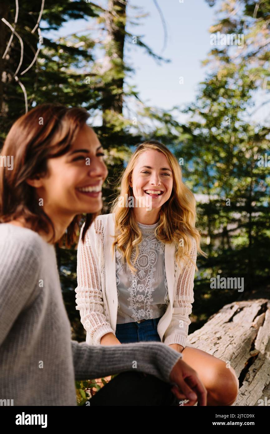Two friends laugh while enjoying nature Stock Photo - Alamy