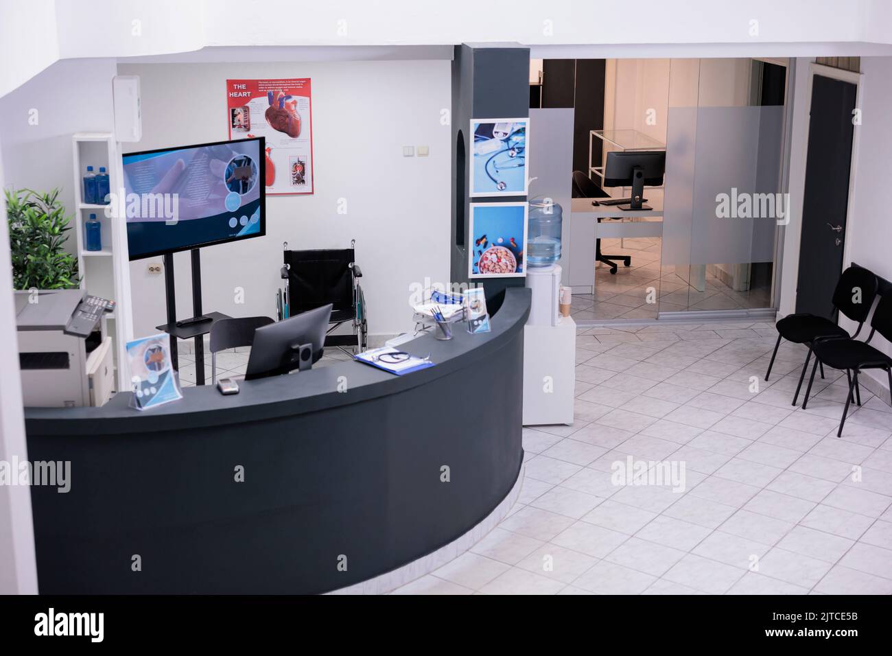 Health center reception desk for appointments and checkup visits in facility lobby, hospital ...
