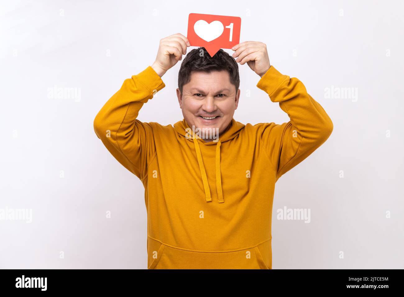 Smiling middle aged man blogger holding likes counter template above ...