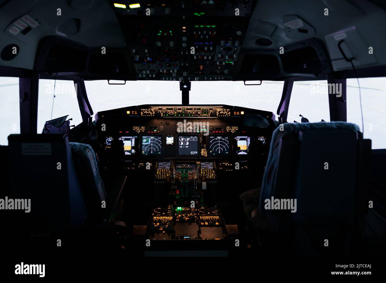 Nobody in empty captain cabin used to fly airplane with dashboard ...