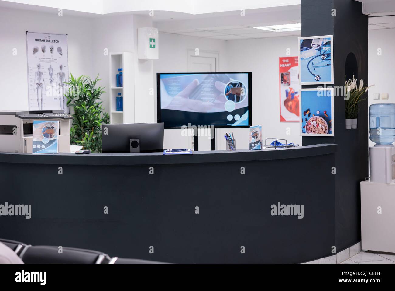 Empty hospital reception counter with computer, making healthcare ...