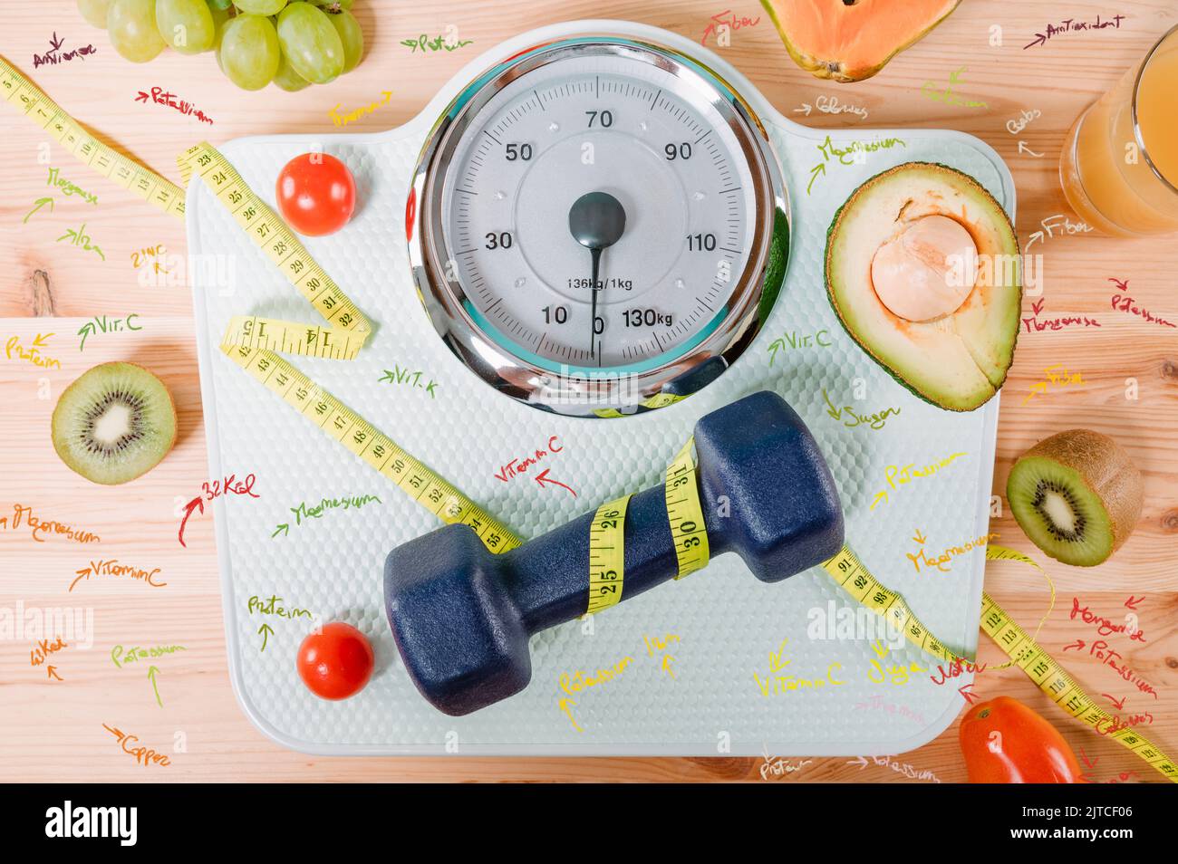 Fitness with dumbbell and genuine food with fresh fruit Stock Photo - Alamy
