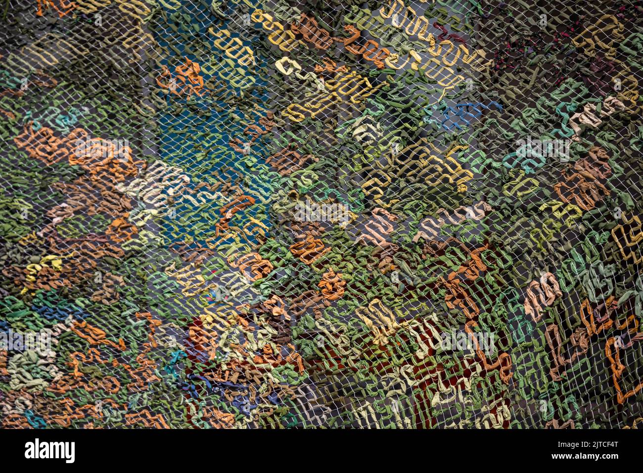 Mesh weaving. Camouflage grids. War in Ukraine. Shades of green. Khaki ...