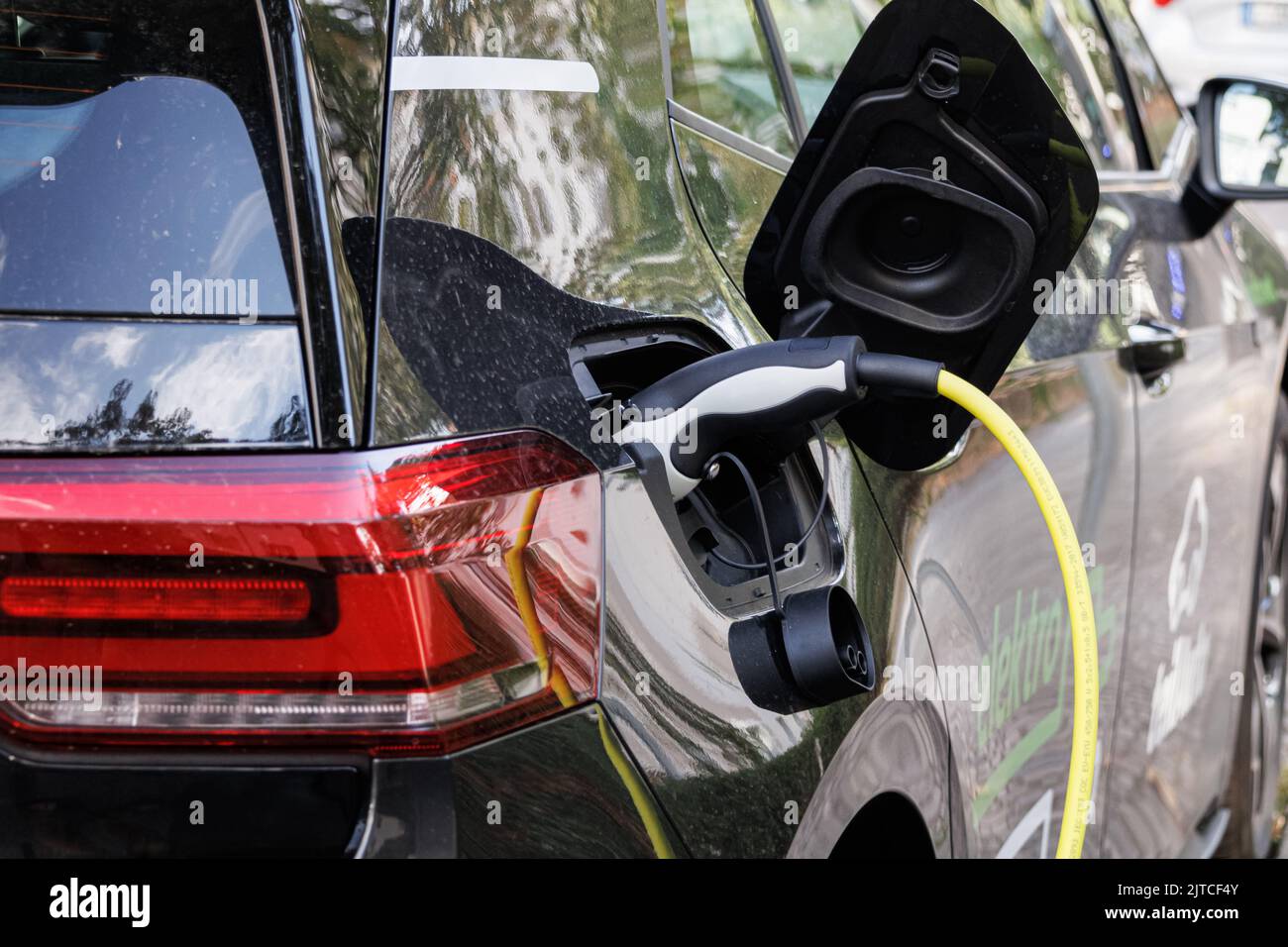 Charging plug of an electric car Stock Photo - Alamy