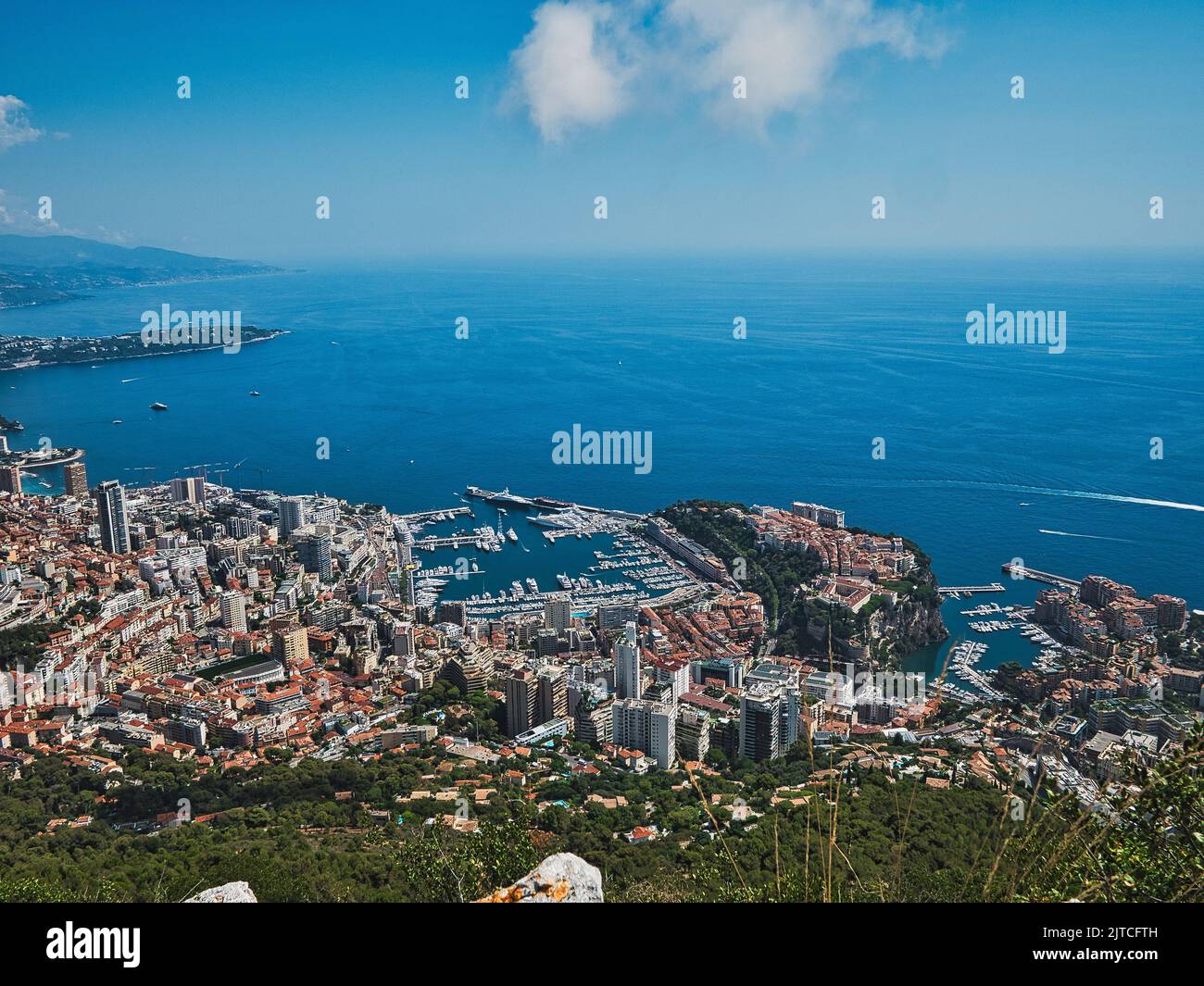 A drone view of a seascape of the port in Monaco city with residential ...