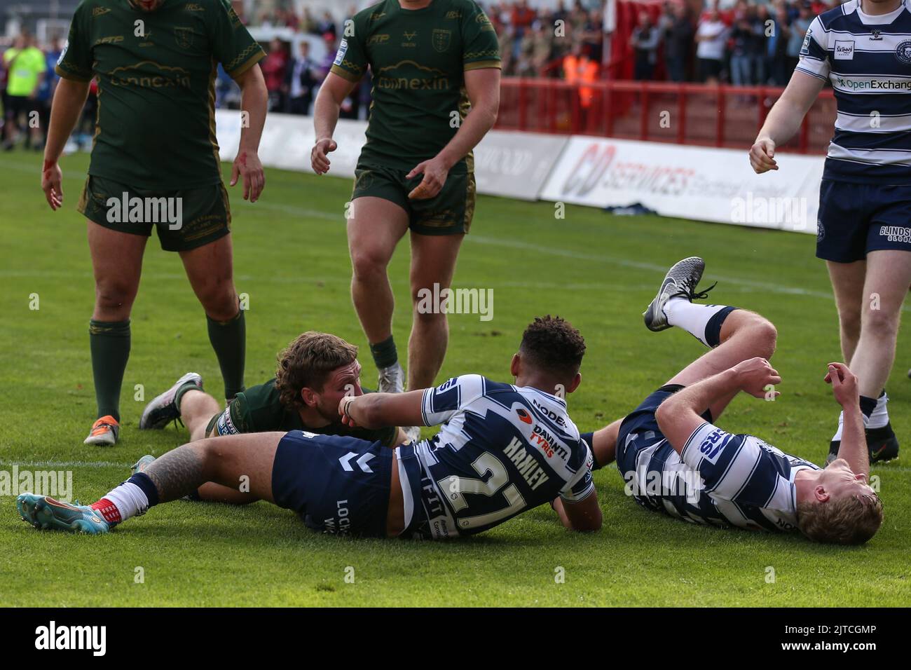 Ethan Ryan #23 of Hull KR looks to the referee to confirm his try Stock ...