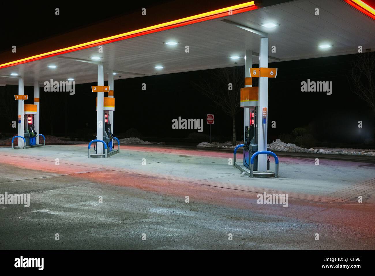 Gas Station Pumps at Night Stock Photo - Alamy