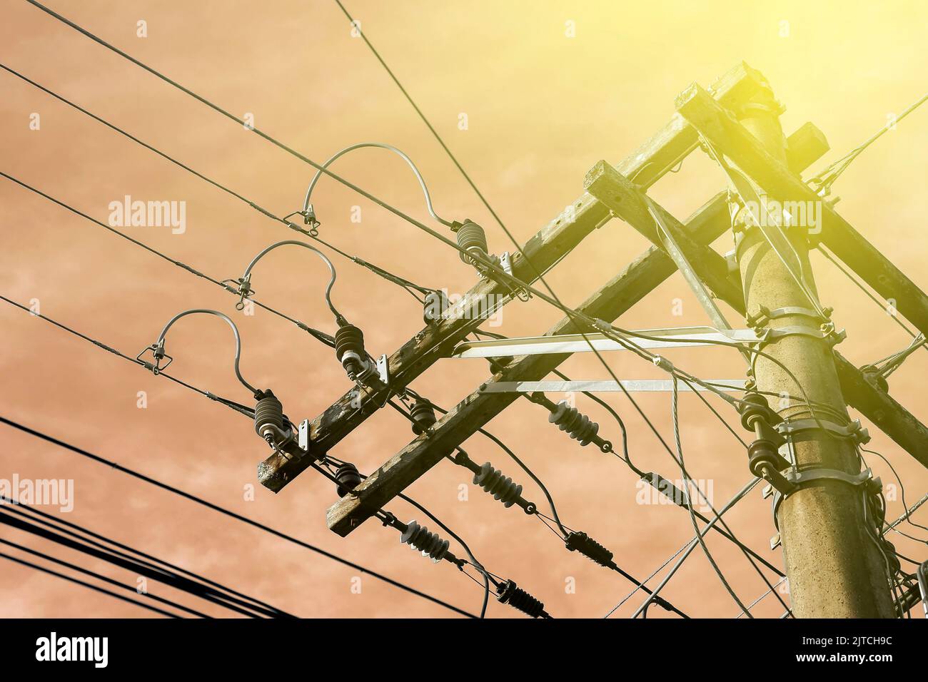 concrete pole with electrical power, telephony and fiber optic cabling ...