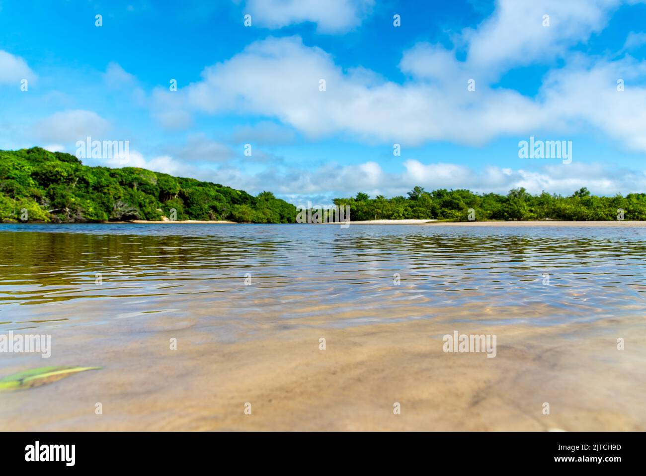 River sand landscape against blue sky in the background. Guaibim beach ...