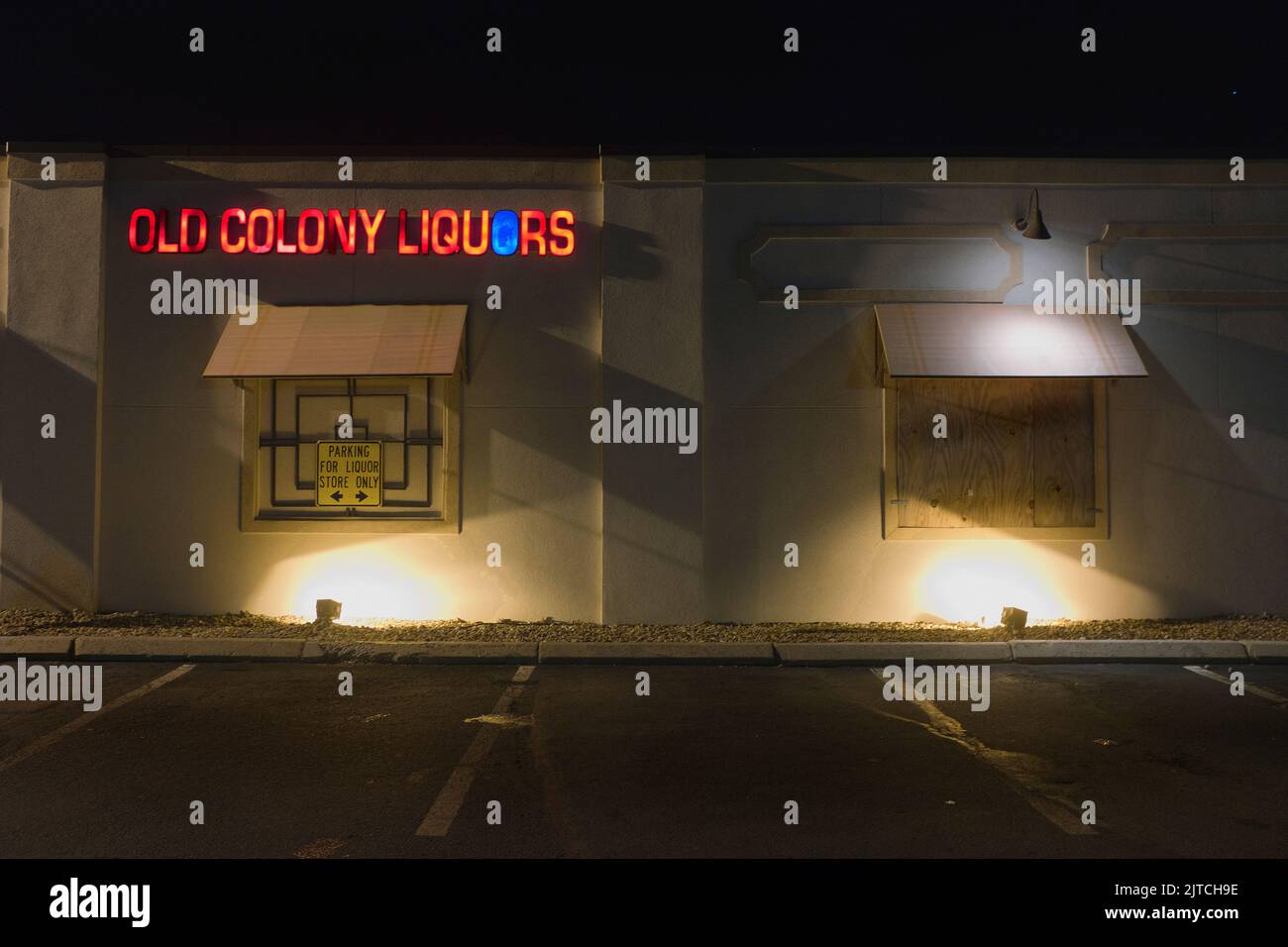 Liquor Store Parking Lot and Building Exterior at Night Stock Photo - Alamy