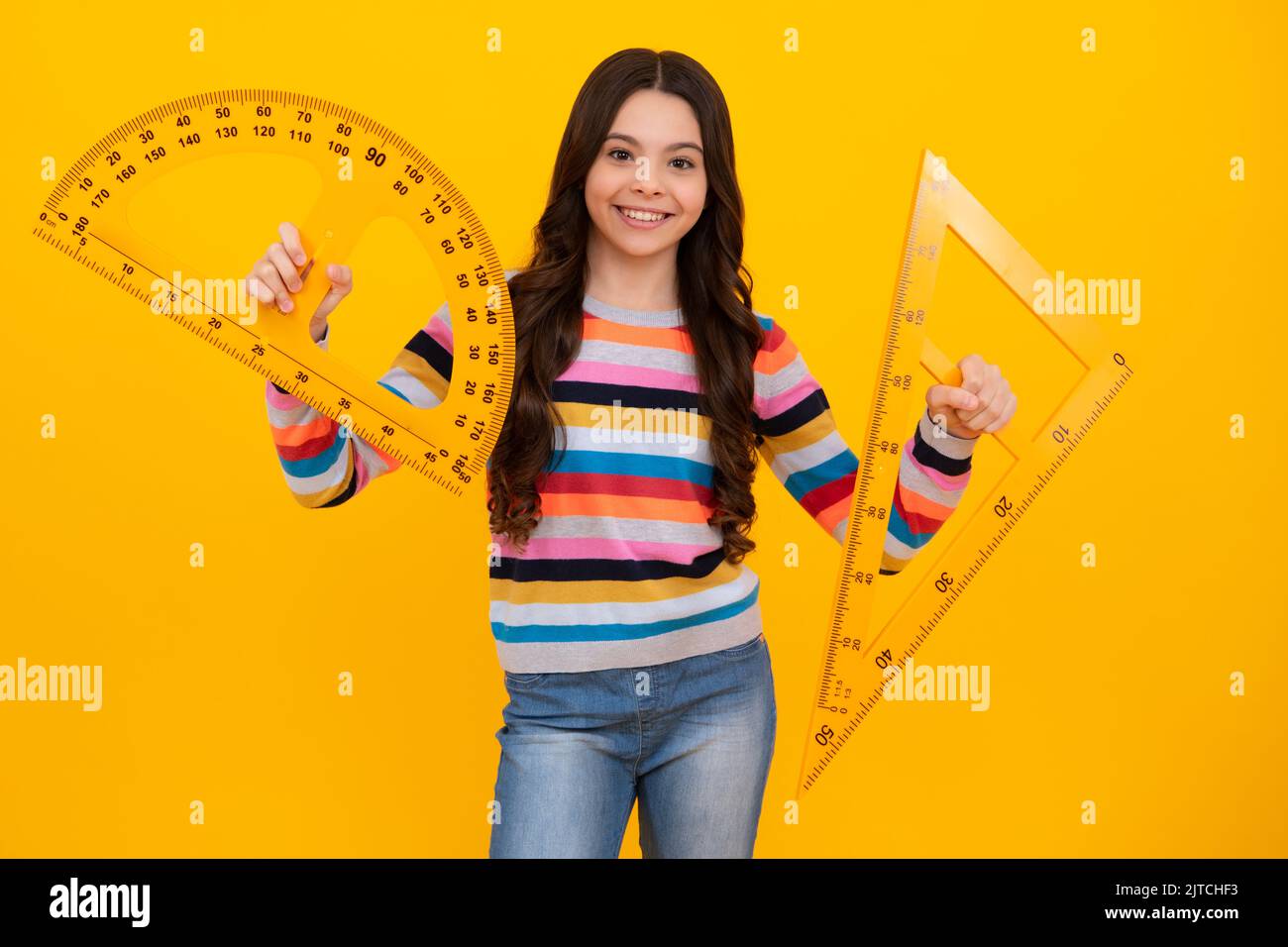 Teenager child school girl holding measure for geometry lesson ...