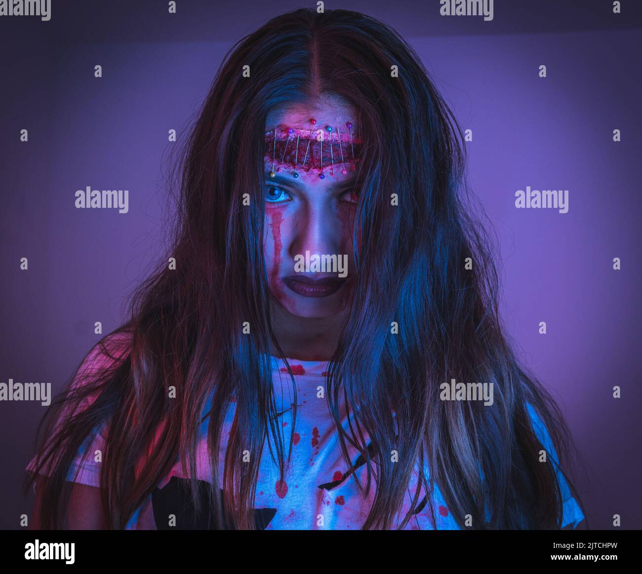 Teen girl dressed and made up for halloween with long hair horror image ...