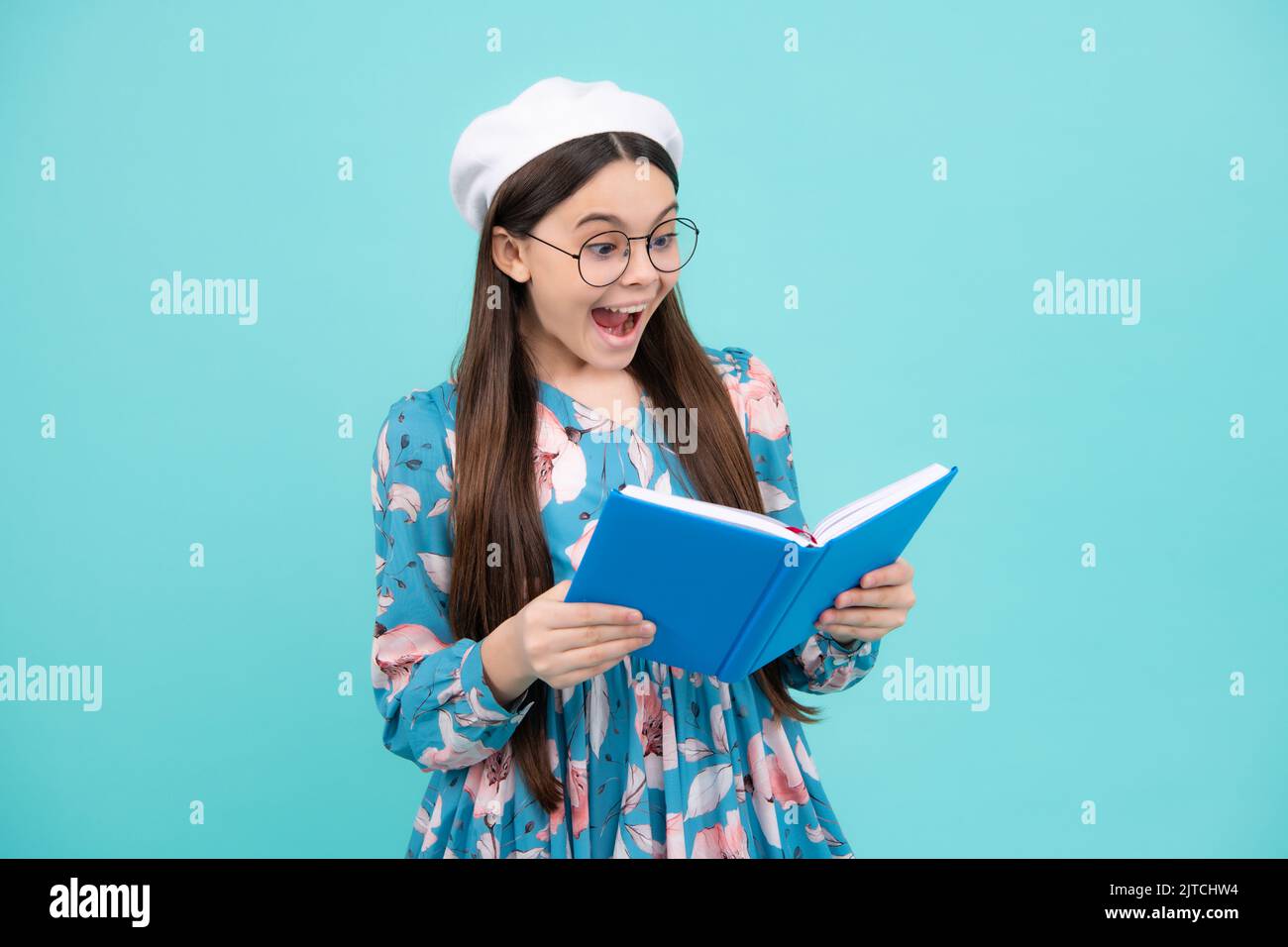 Schoolgirl with copy book posing on isolated background. Literature ...