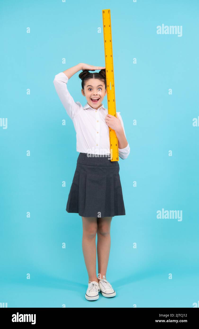 Kid Height Measure Growth Measurement School Girl Holding Measure For kid-height-measure-growth-measurement-school-girl-holding-measure-for