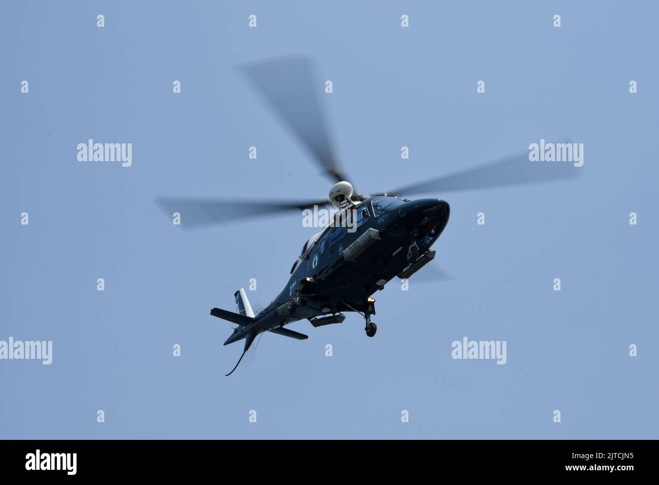 A Nigerian Navy helicopter conducts flight operations during an anti ...