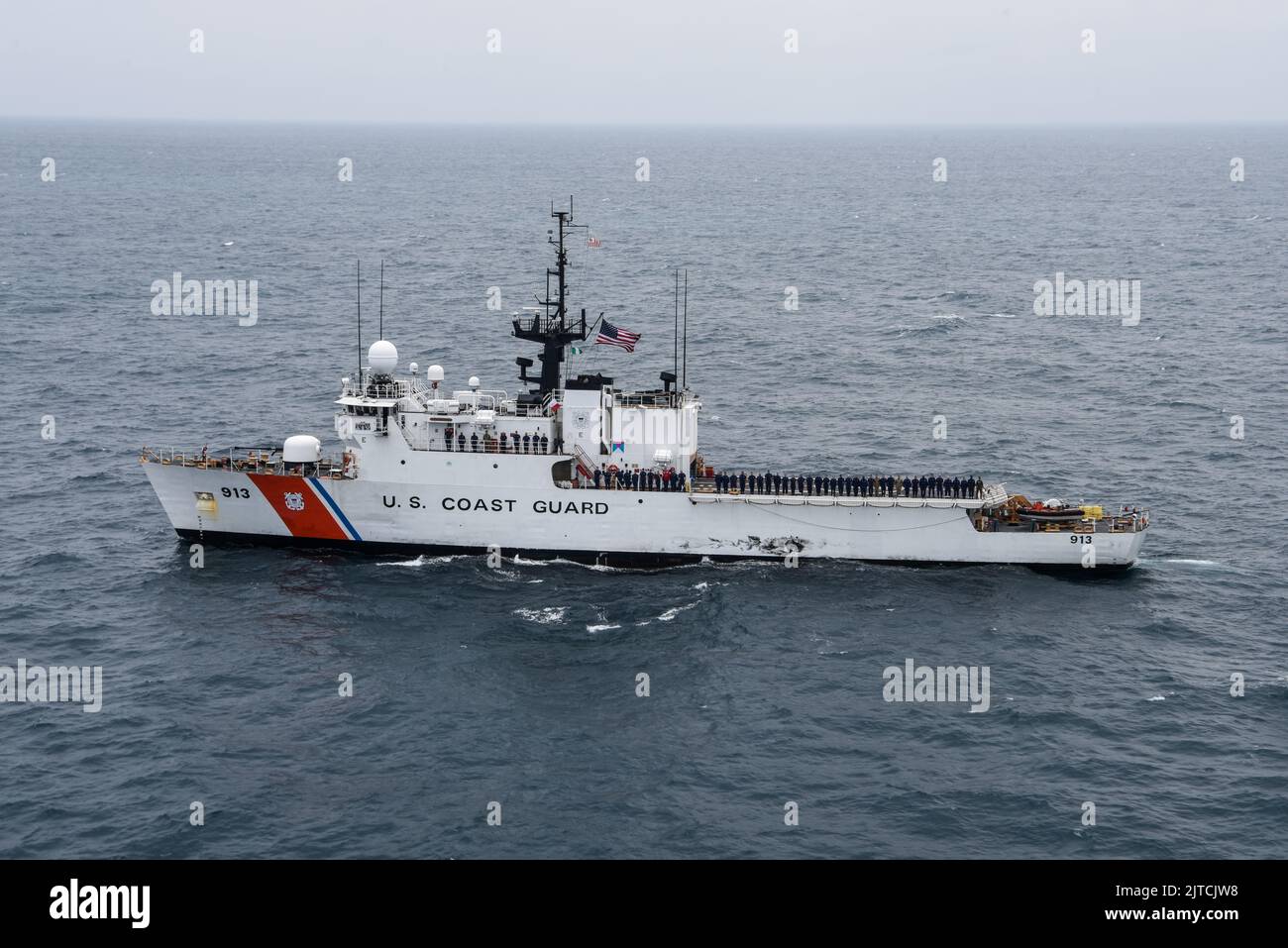 Crew members assigned to USCGC Mohawk (WMEC 913) man the rails while ...