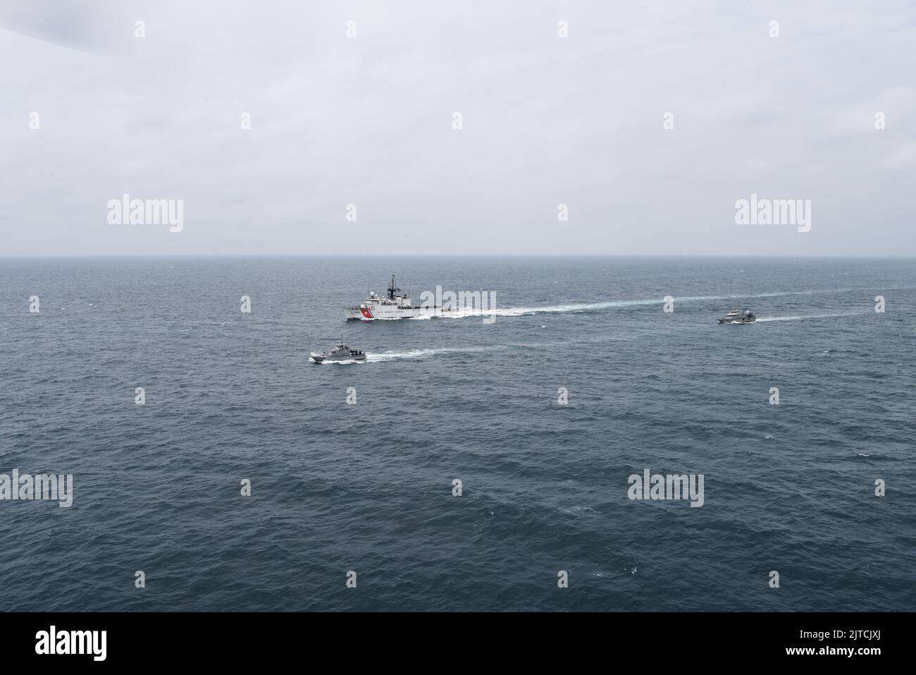 USCGC Mohawk (WMEC 913) sails alongside two Nigerian Navy ships in the ...