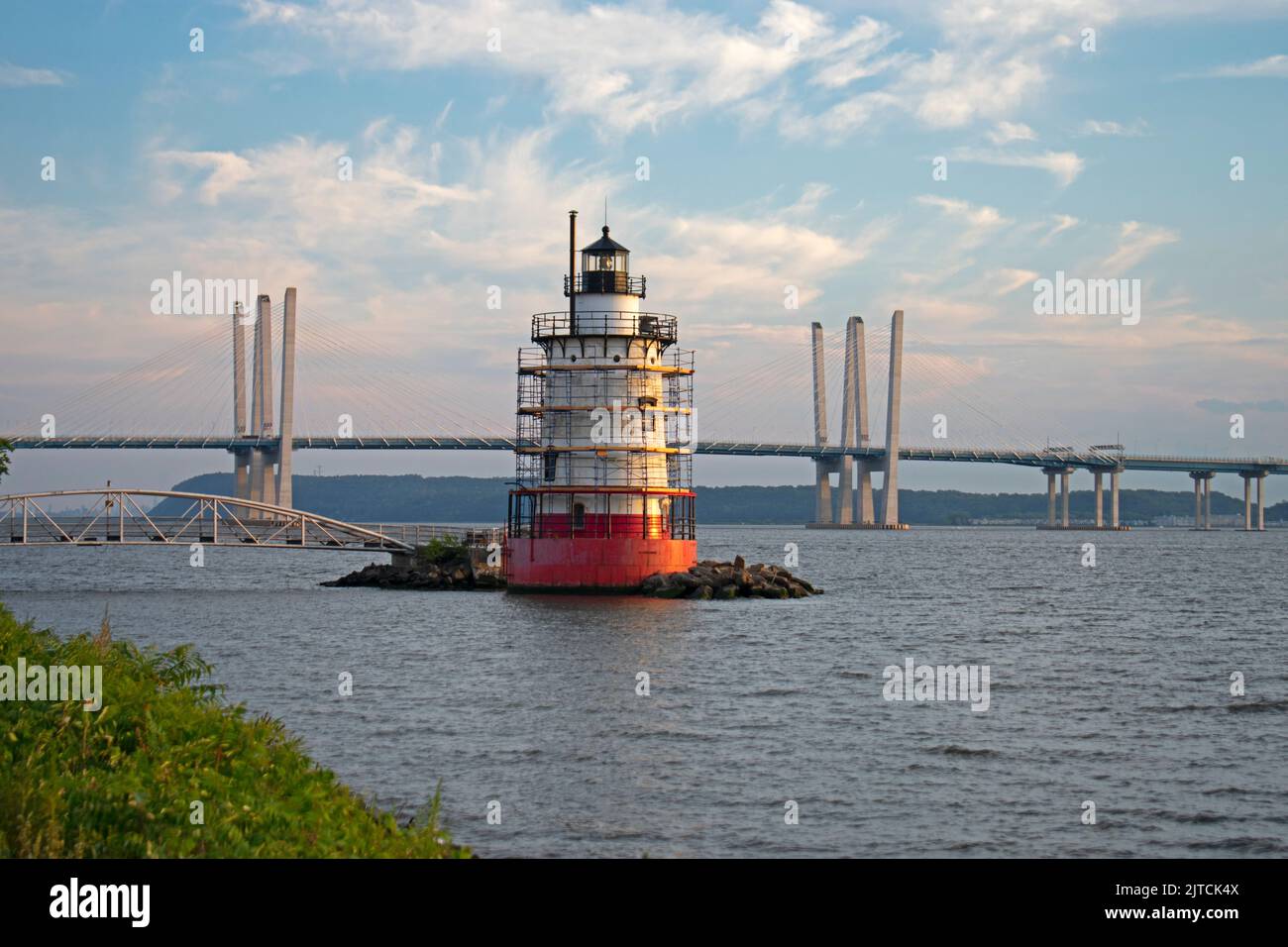 Short, red and white lighthouse, under renovation, along the Hudson ...