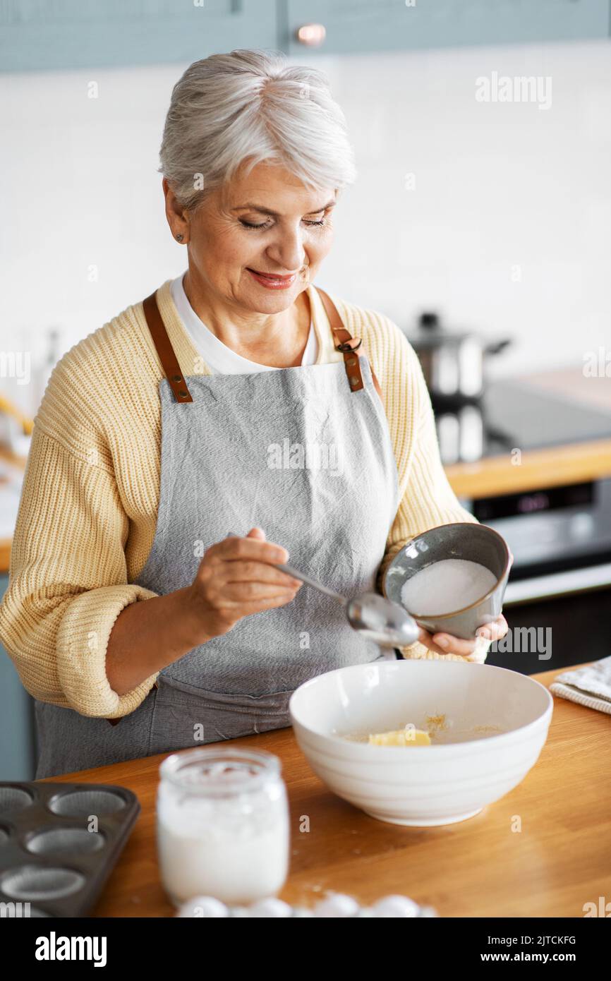 happy woman cooking food on kitchen at home Stock Photo - Alamy
