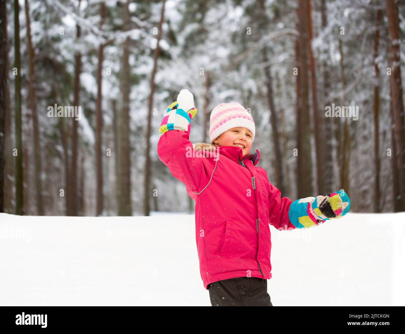 Kid playing snowball fight hi-res stock photography and images - Alamy
