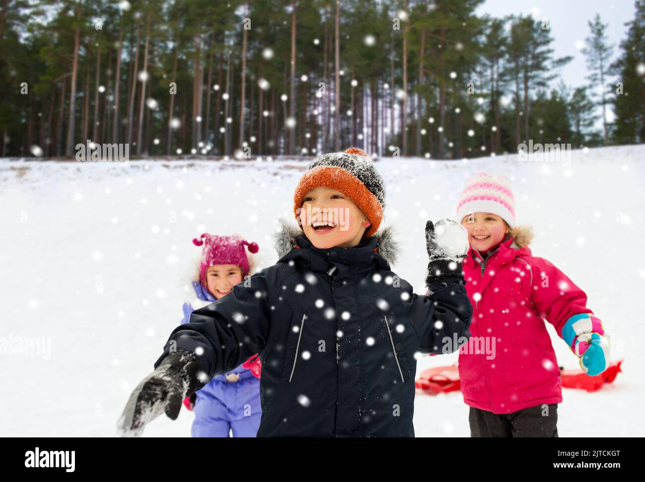 happy little kids playing snowball fight in winter Stock Photo - Alamy