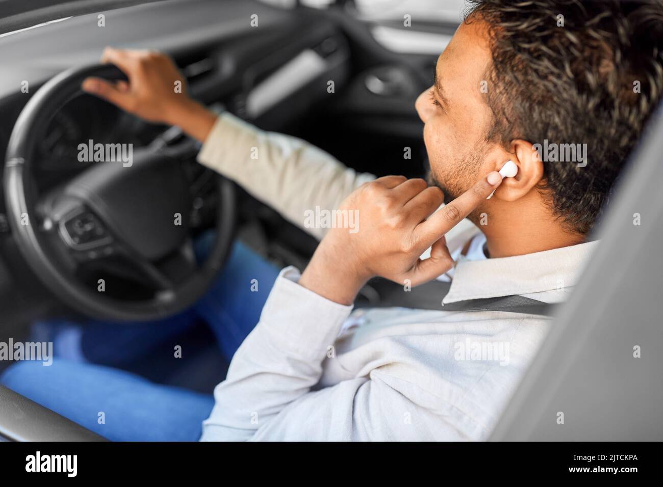Driving with earphones hi-res stock photography and images - Alamy