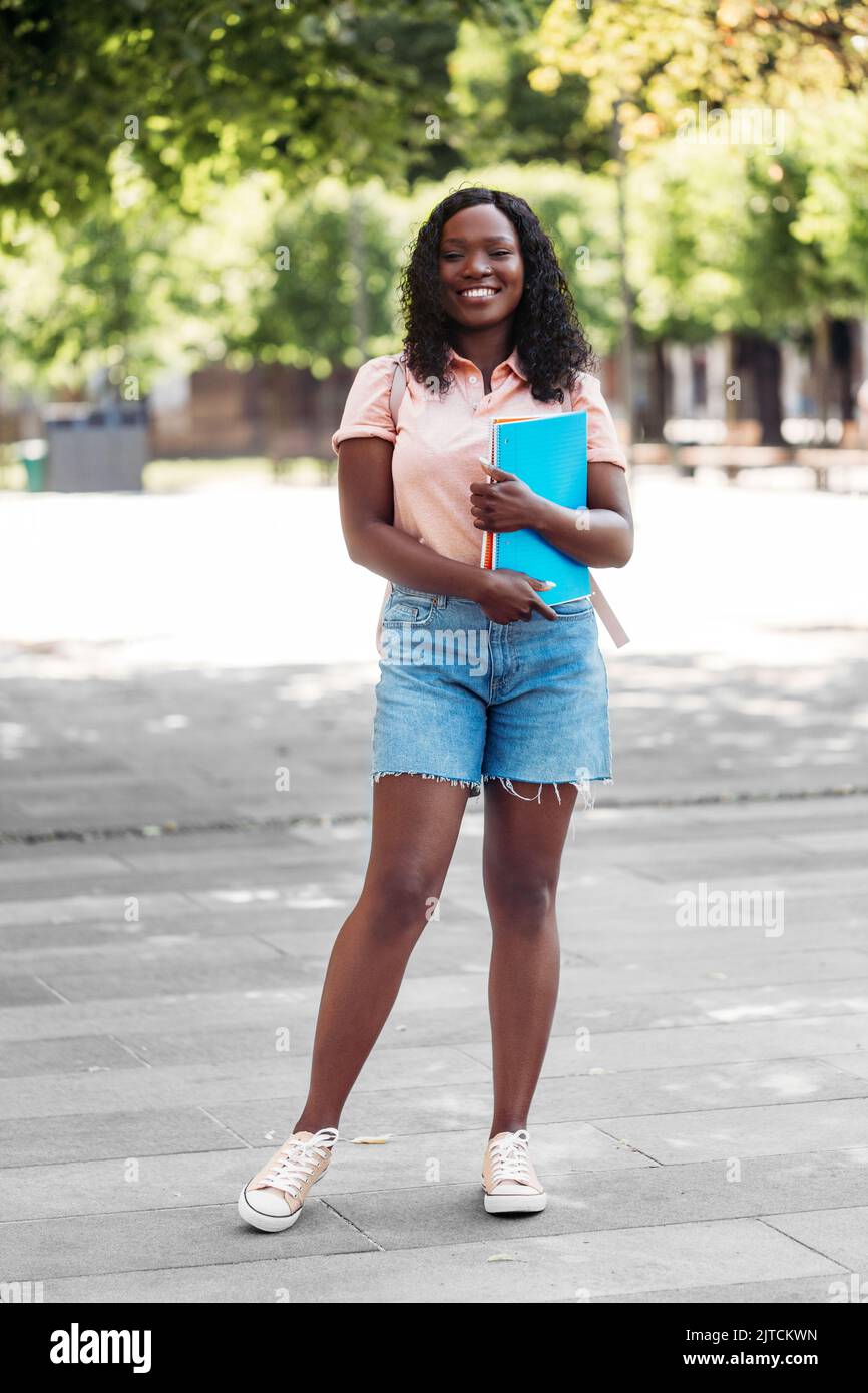 african student girl with notebooks in city Stock Photo - Alamy