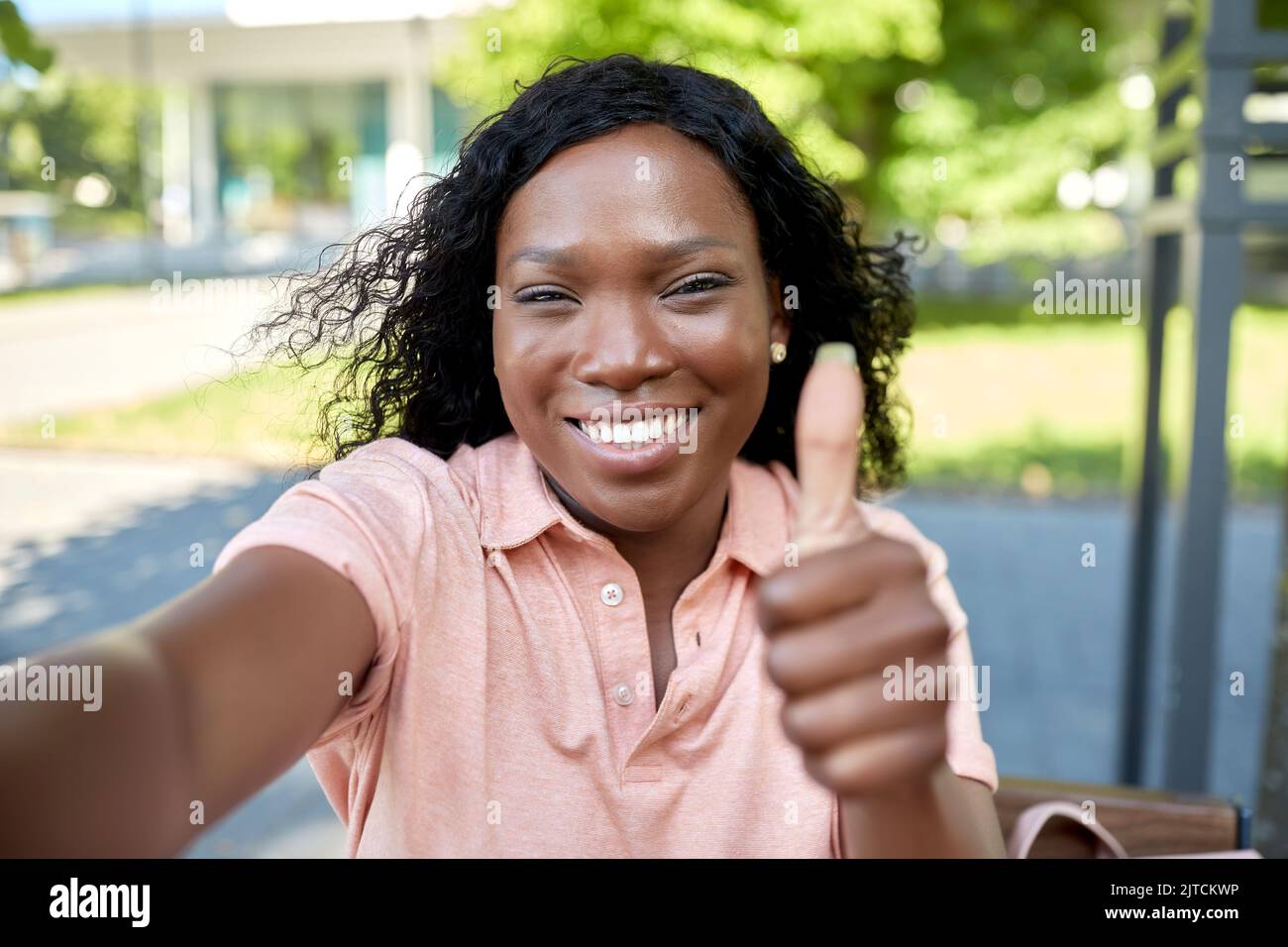 happy african american woman taking selfie in city Stock Photo - Alamy