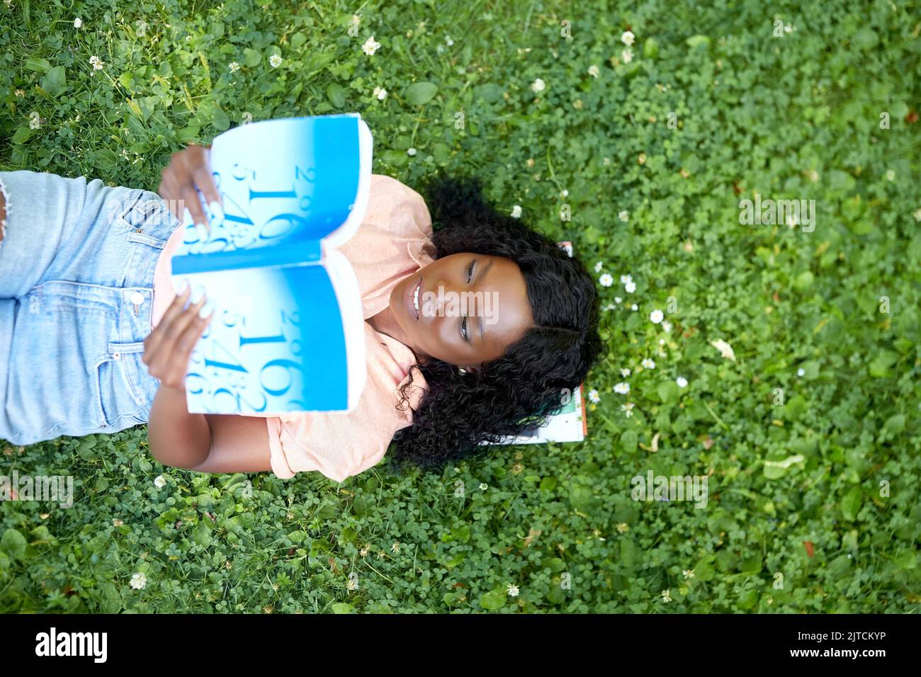 african student girl reading math textbook Stock Photo - Alamy