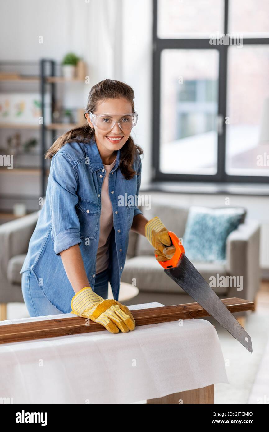 Woman sawing wood hi-res stock photography and images - Alamy