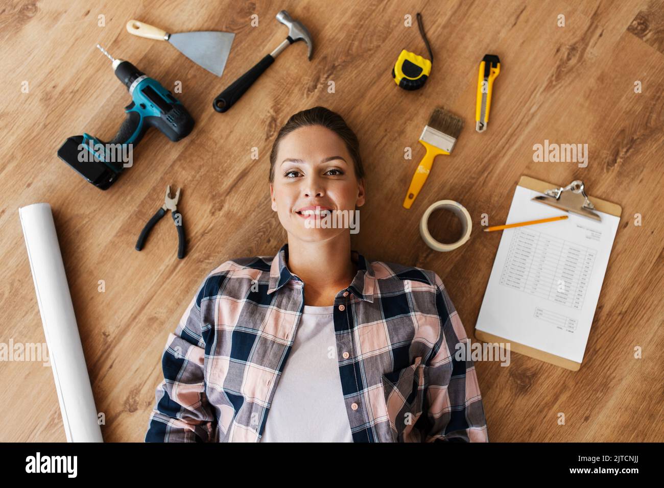 Female construction worker floor hi-res stock photography and images ...