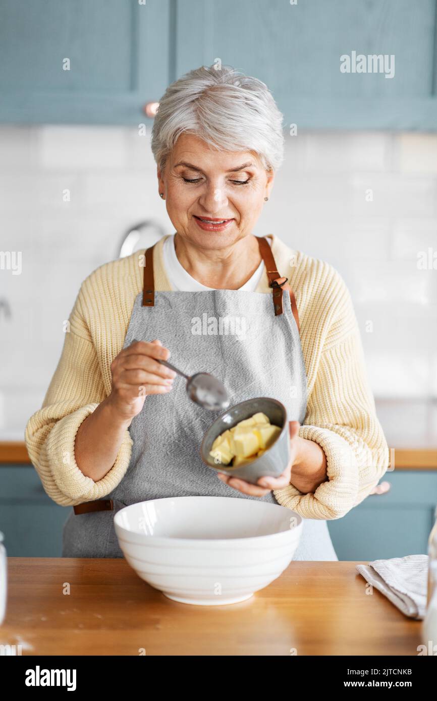 Woman making butter hi-res stock photography and images - Alamy
