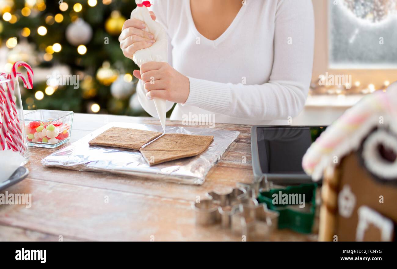 Woman glazing traditional gingerbread hi-res stock photography and ...